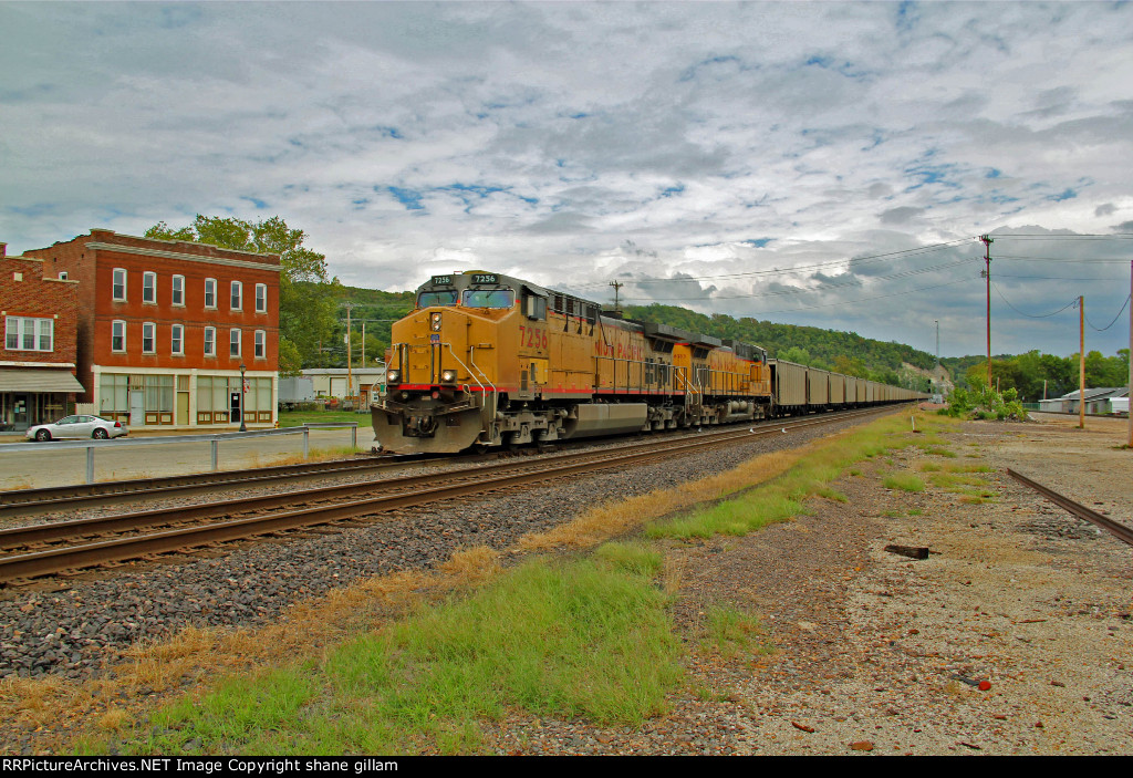 UP 7256 leads a Wb coal under some great skys.